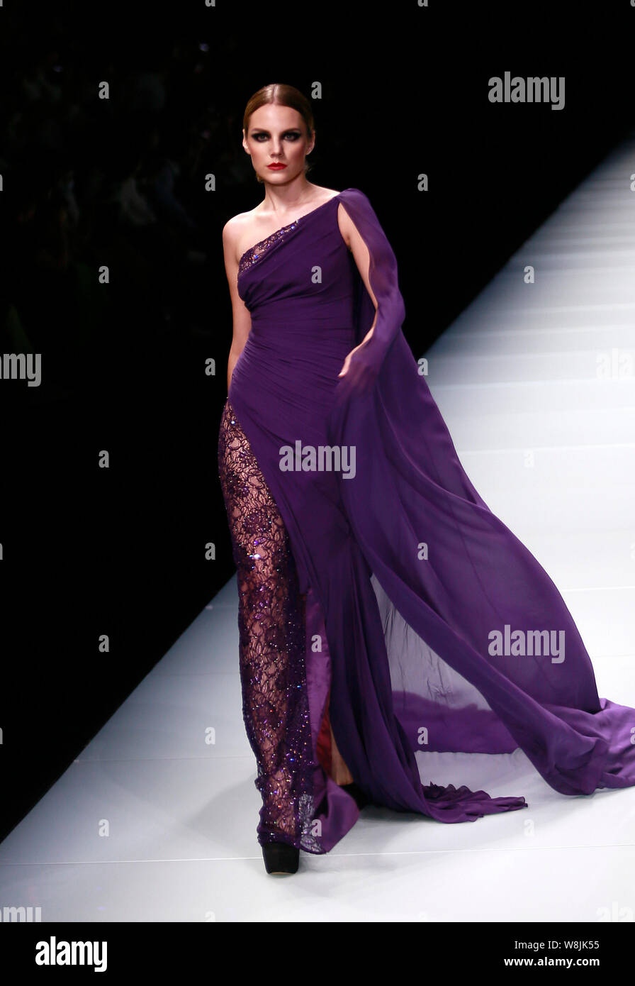 A model displays a new creation by Chinese fashion designer Mary Ma in ...