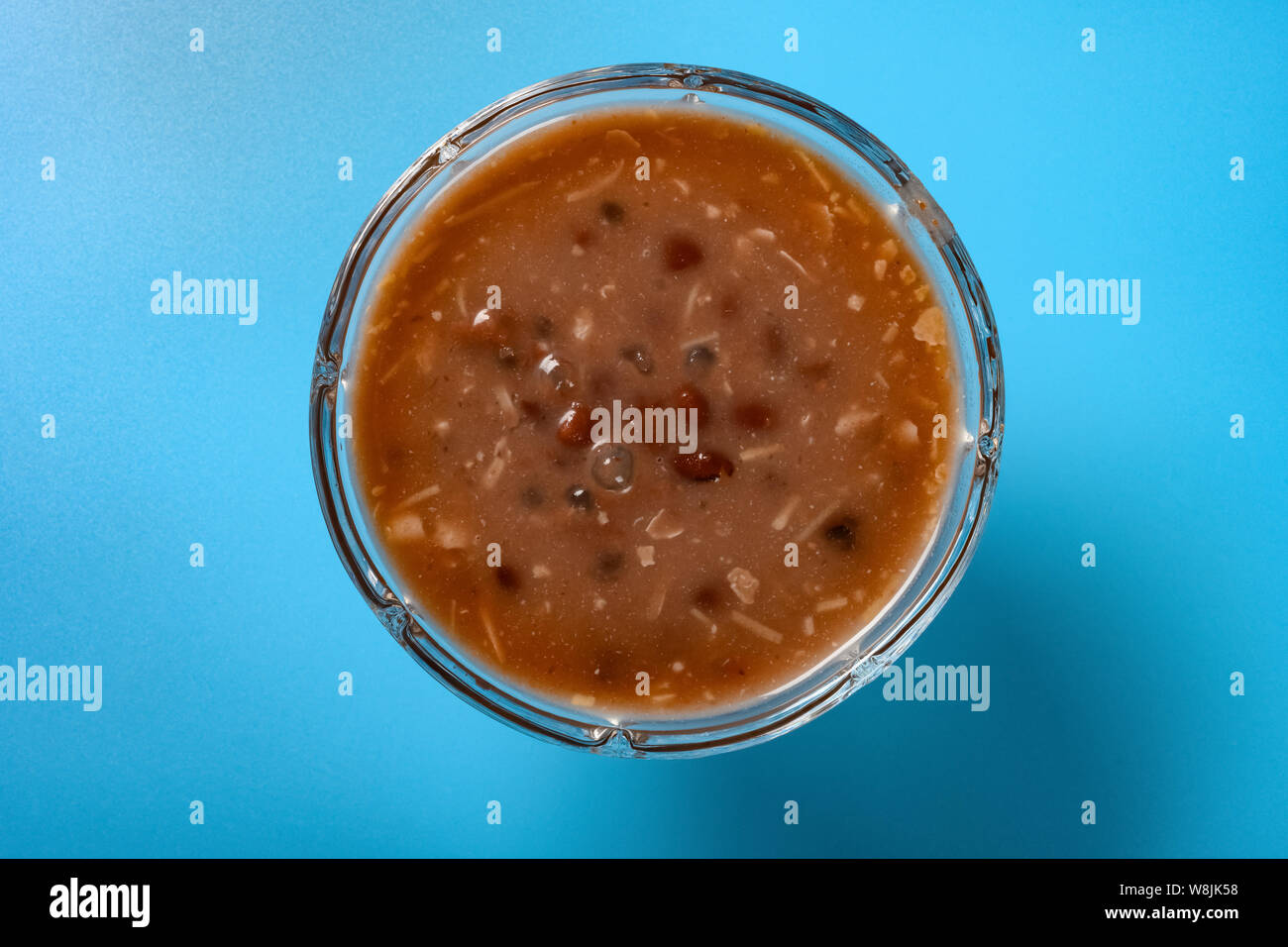 top view Chinese syrup of red bean and sago with shredded coconut in a ...