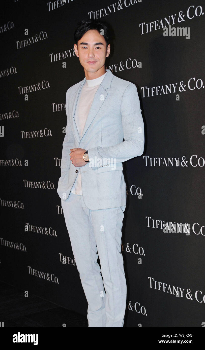 Taiwanese actor Ethan Juan poses as he arrives for a new products ...