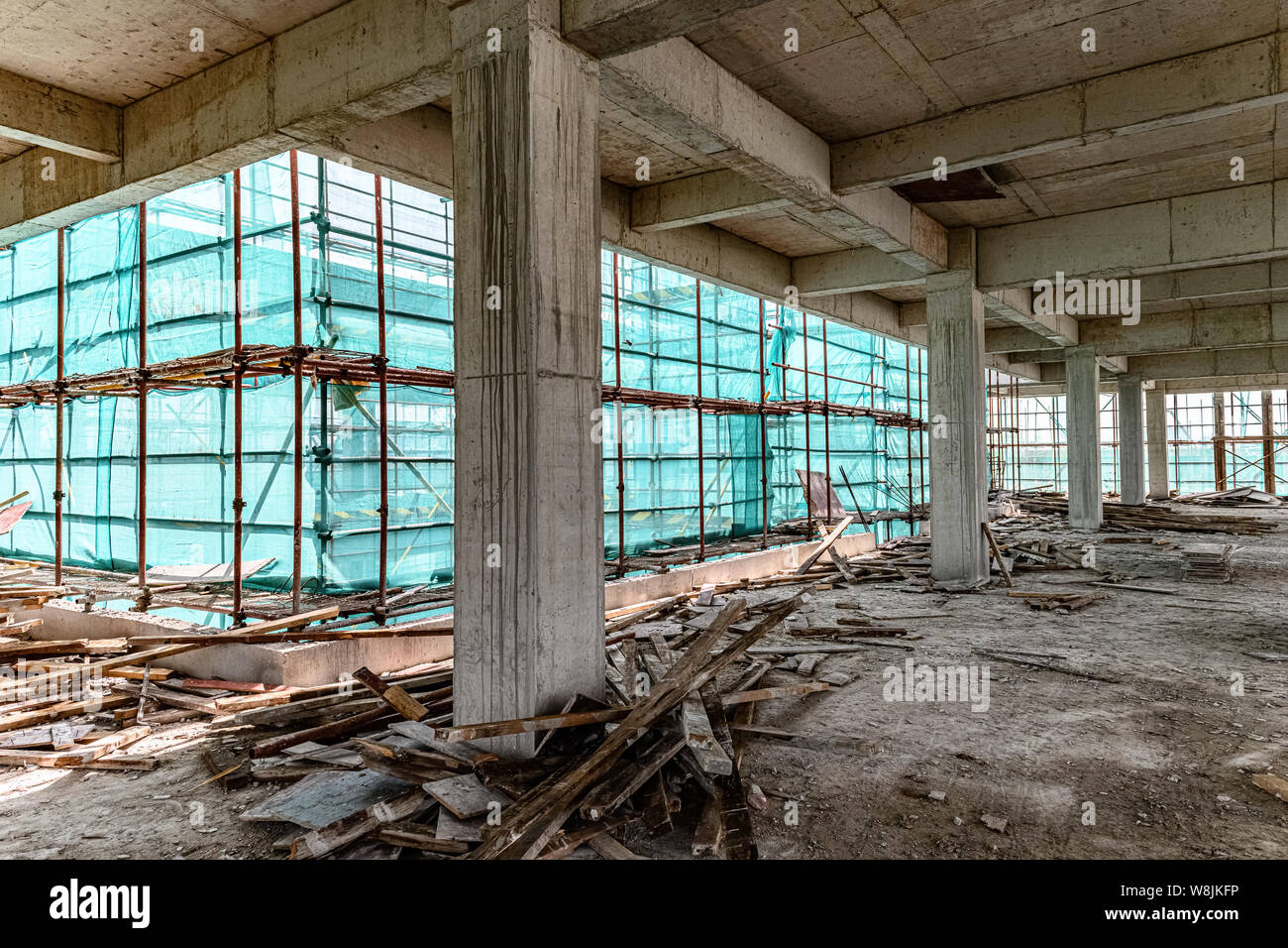 inside of an unfinshed building with protection scaffolding and netting ...