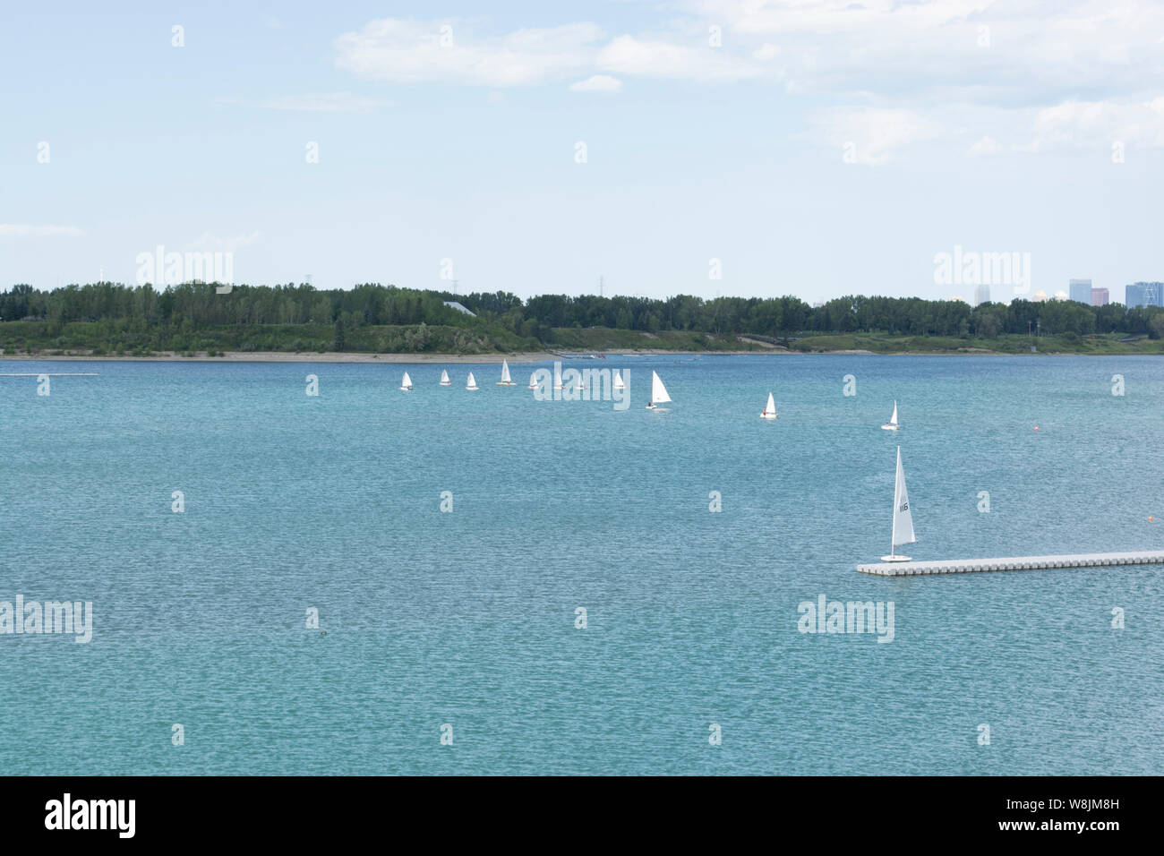 Sailing boats from a distance on fresh water lake Stock Photo - Alamy