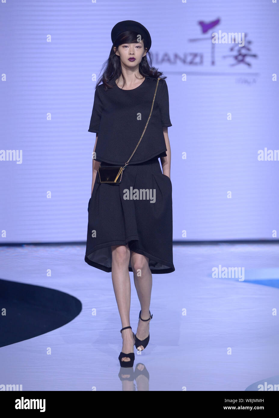 A model displays a new creation at the Qianzi fashion show by Italian ...