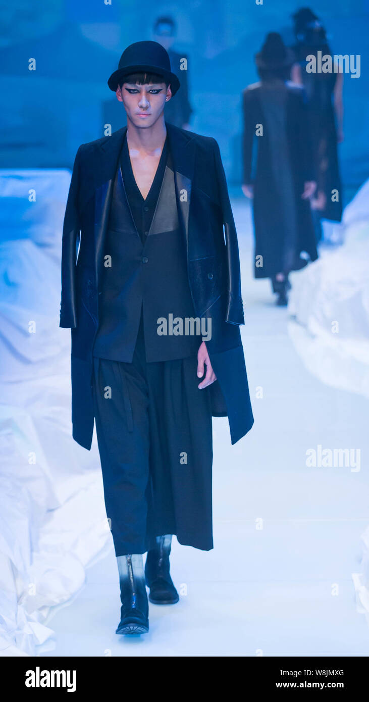 A model displays a new creation designed by Liu Shixi at the "The ...