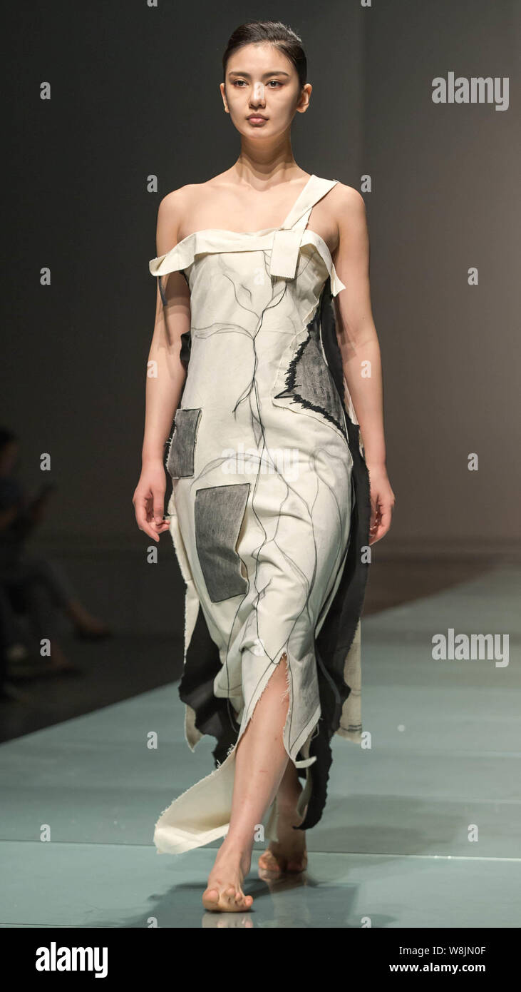 A model displays a creation designed by a student from School of ...