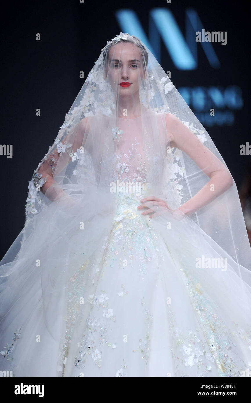 A model displays a new creation at the haute couture fashion show of ...