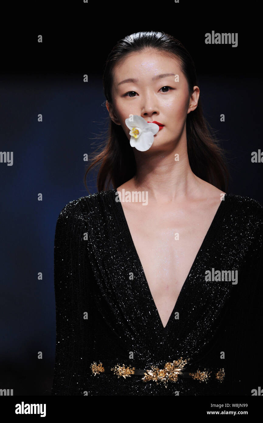 A model displays a new creation at the haute couture fashion show of ...