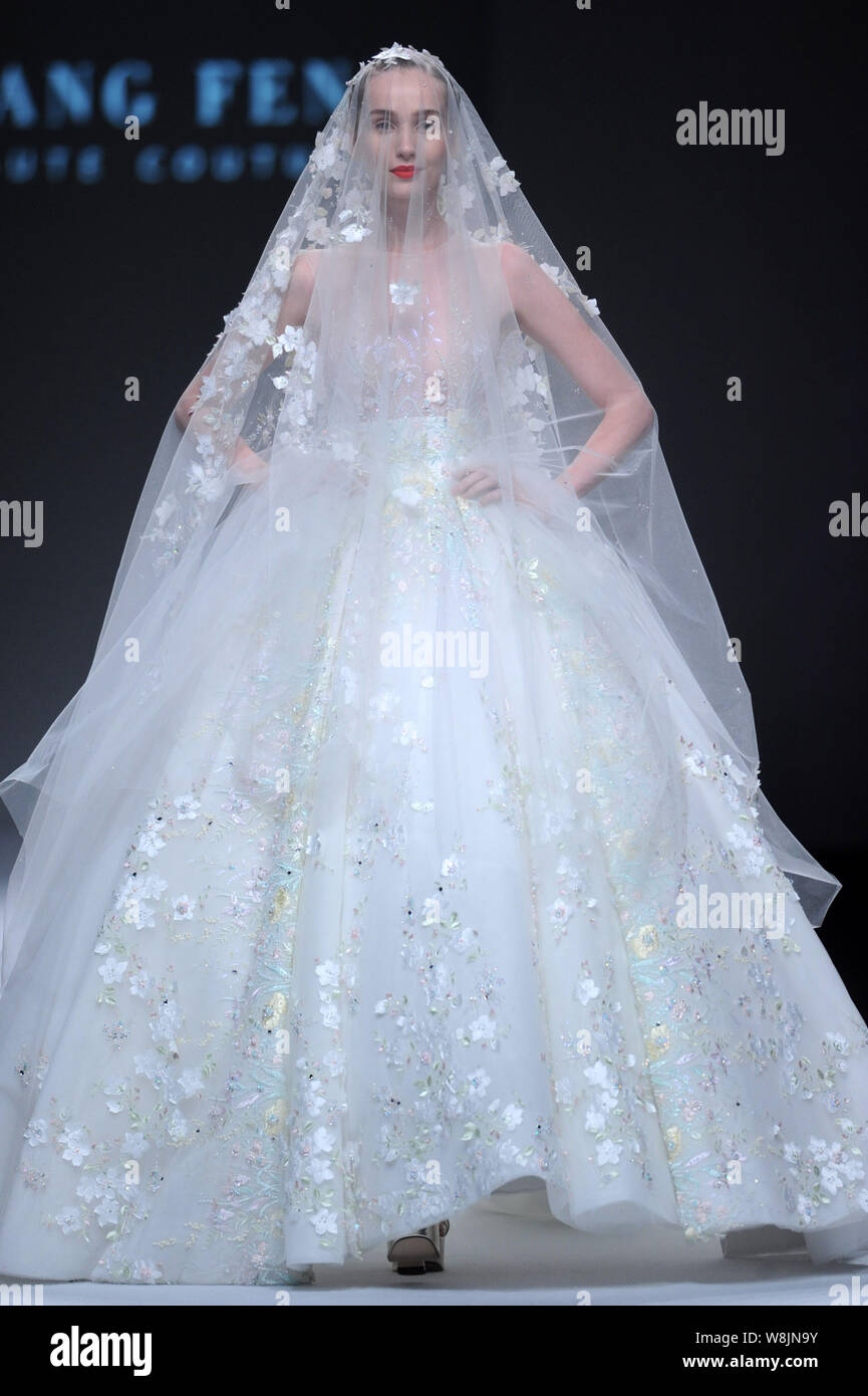 A model displays a new creation at the haute couture fashion show of ...