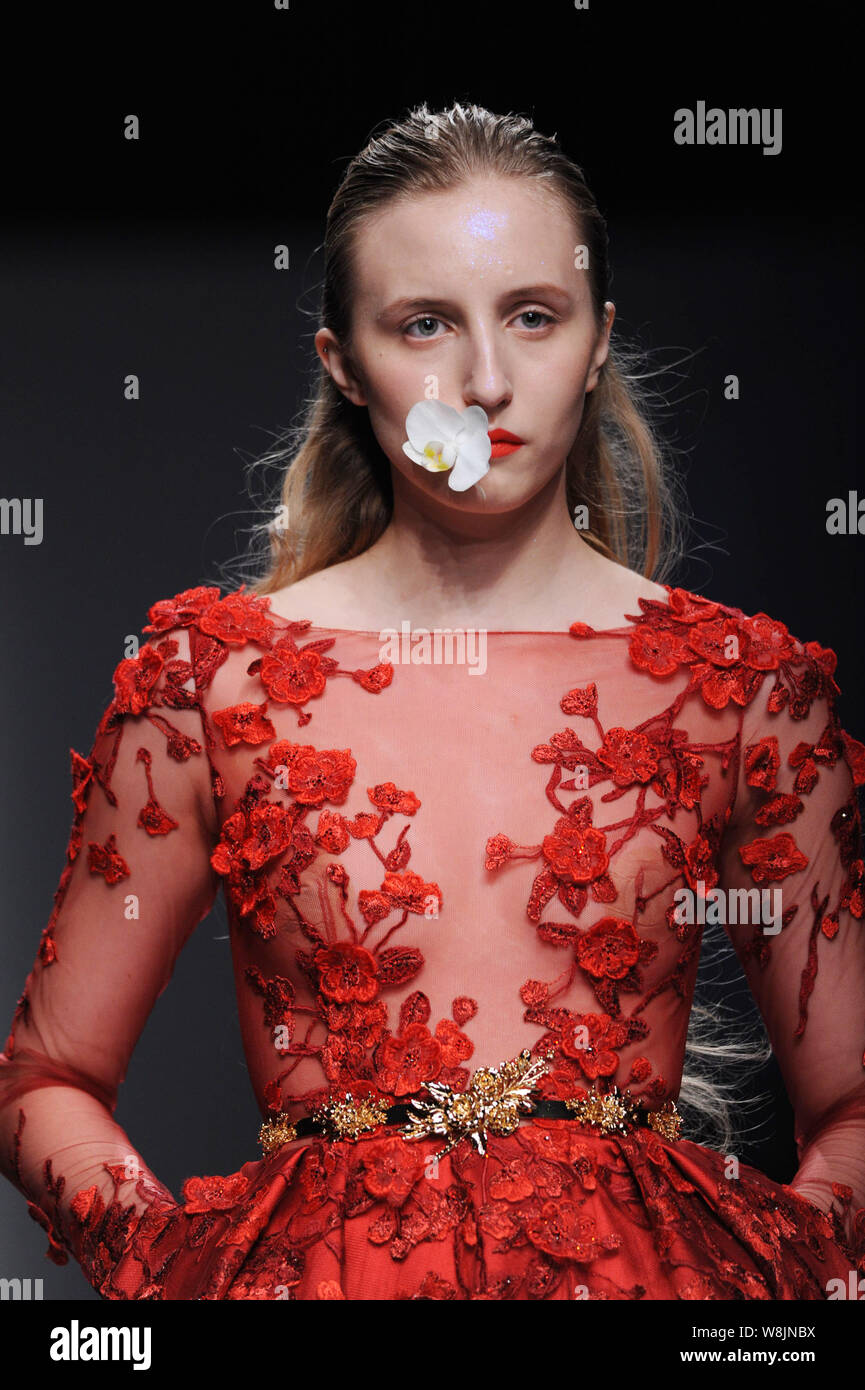 A model displays a new creation at the haute couture fashion show of ...