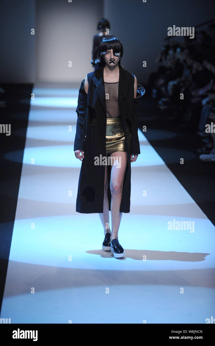 A model displays a new creation at the Zhang Yuhao fashion show during ...