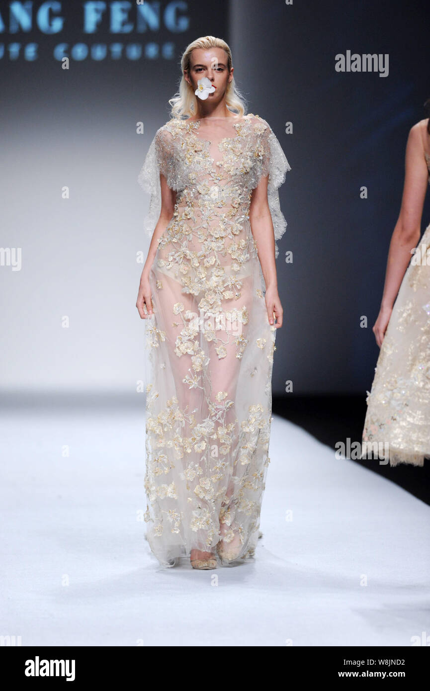 A model displays a new creation at the haute couture fashion show of ...