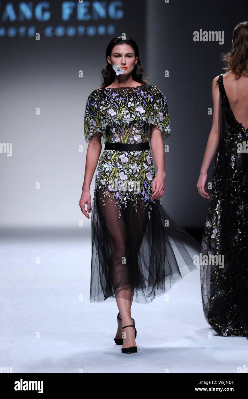 A model displays a new creation at the haute couture fashion show of ...