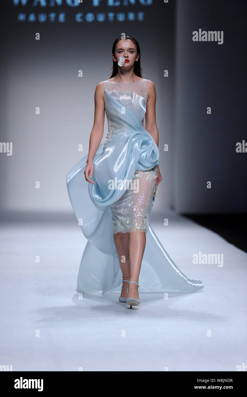 A model displays a new creation at the haute couture fashion show of ...