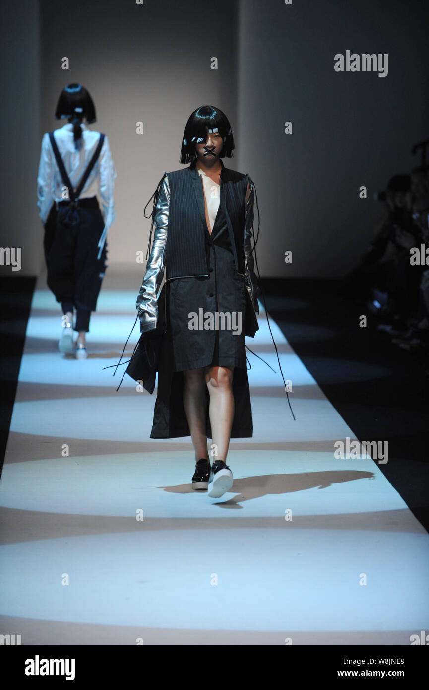 A model displays a new creation at the Zhang Yuhao fashion show during ...