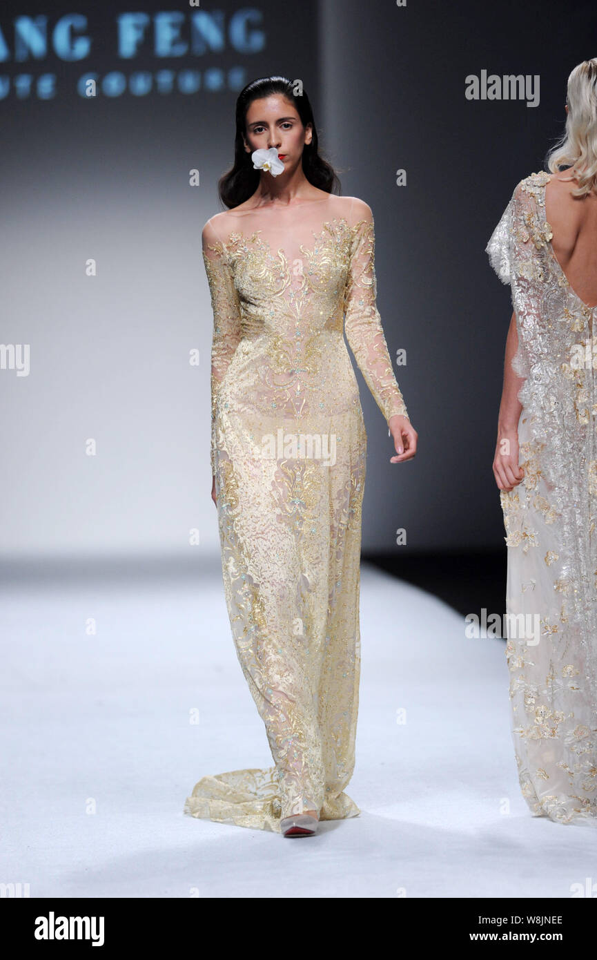 A model displays a new creation at the haute couture fashion show of ...