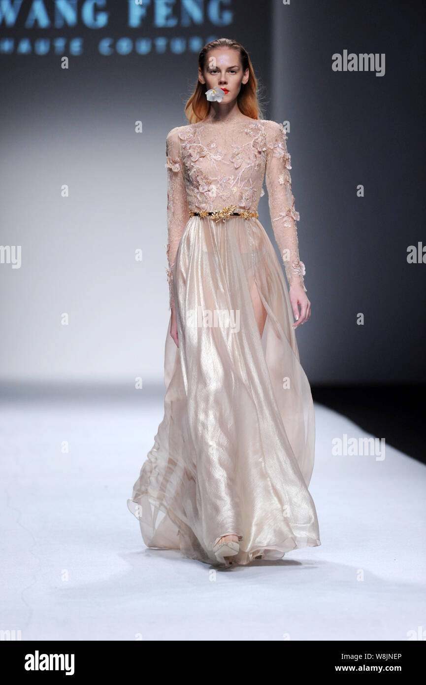 A model displays a new creation at the haute couture fashion show of ...