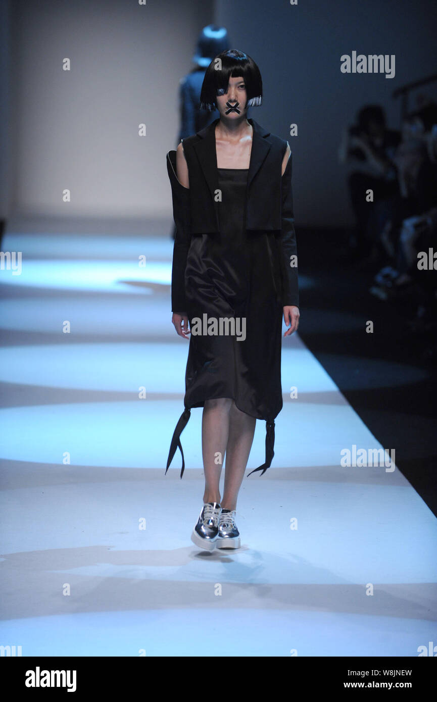 A model displays a new creation at the Zhang Yuhao fashion show during ...