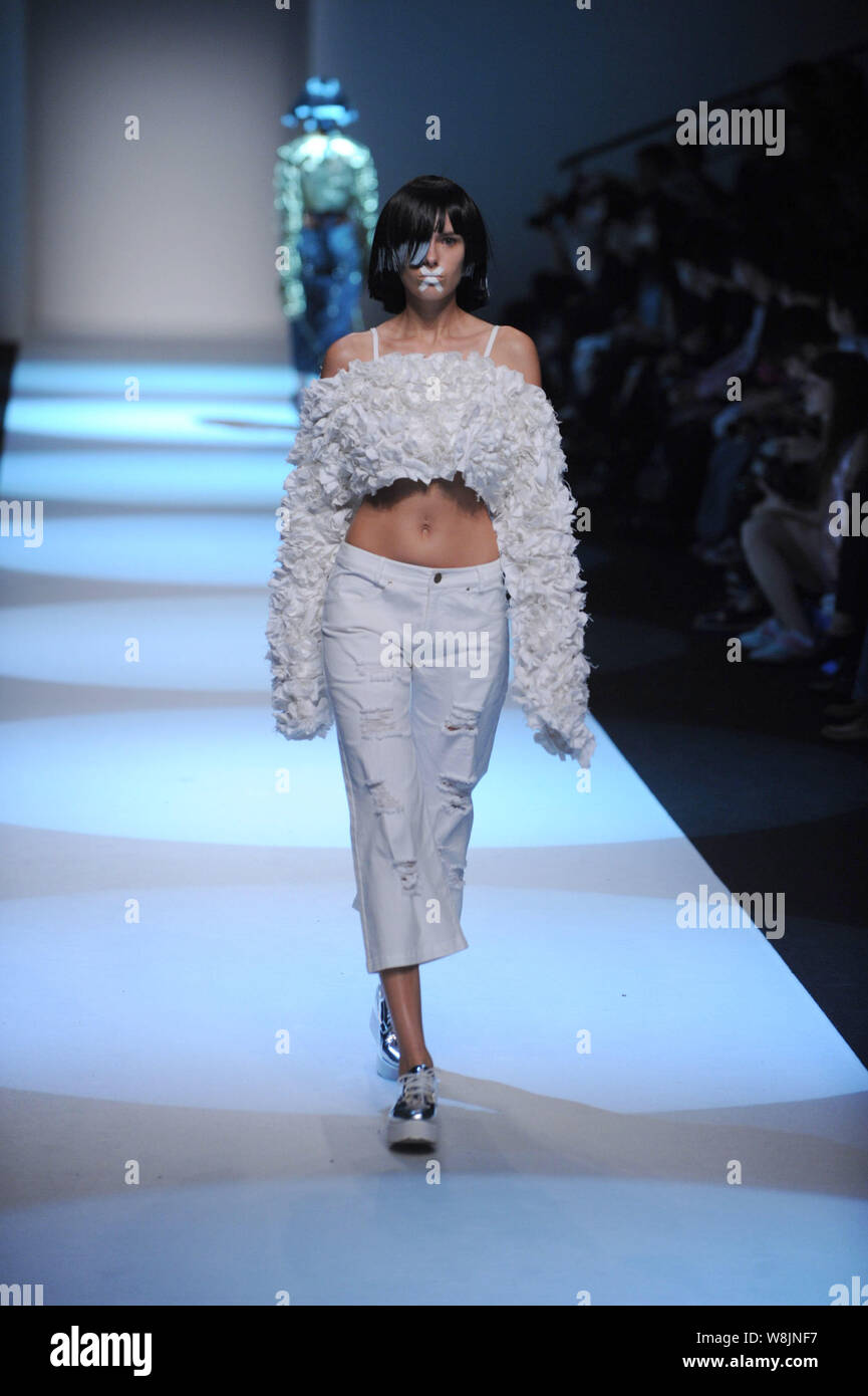 A model displays a new creation at the Zhang Yuhao fashion show during ...