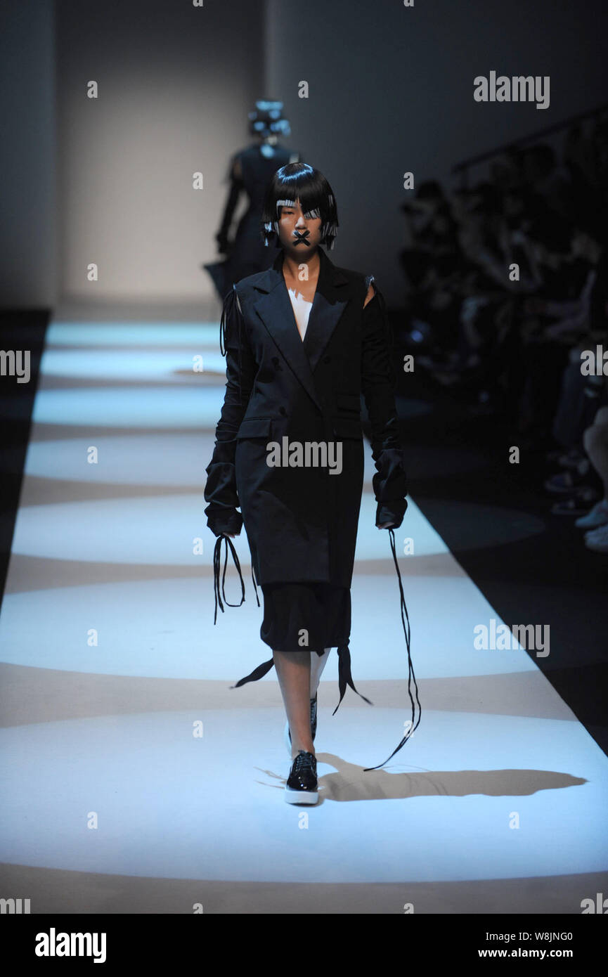 A model displays a new creation at the Zhang Yuhao fashion show during ...