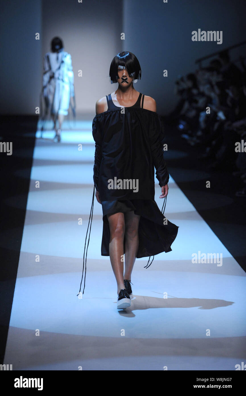 A model displays a new creation at the Zhang Yuhao fashion show during ...
