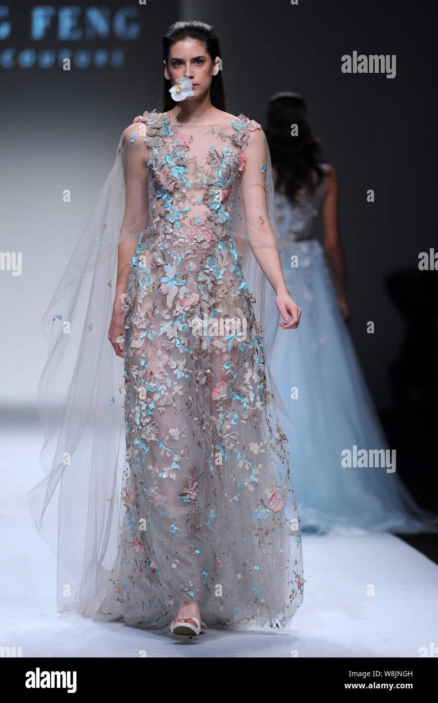 A model displays a new creation at the haute couture fashion show of ...