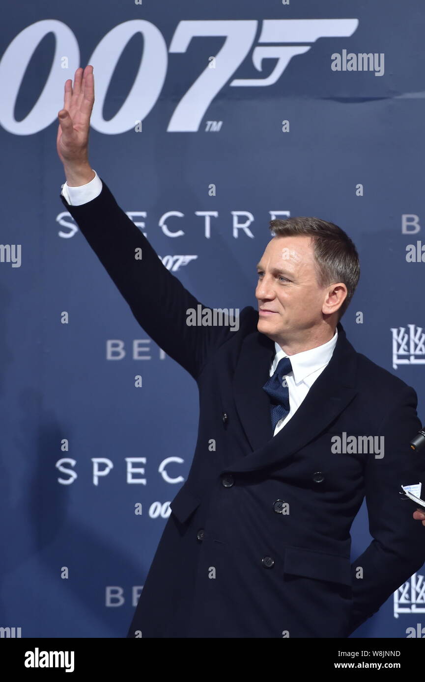 English actor Daniel Craig waves during a premiere for his movie ...