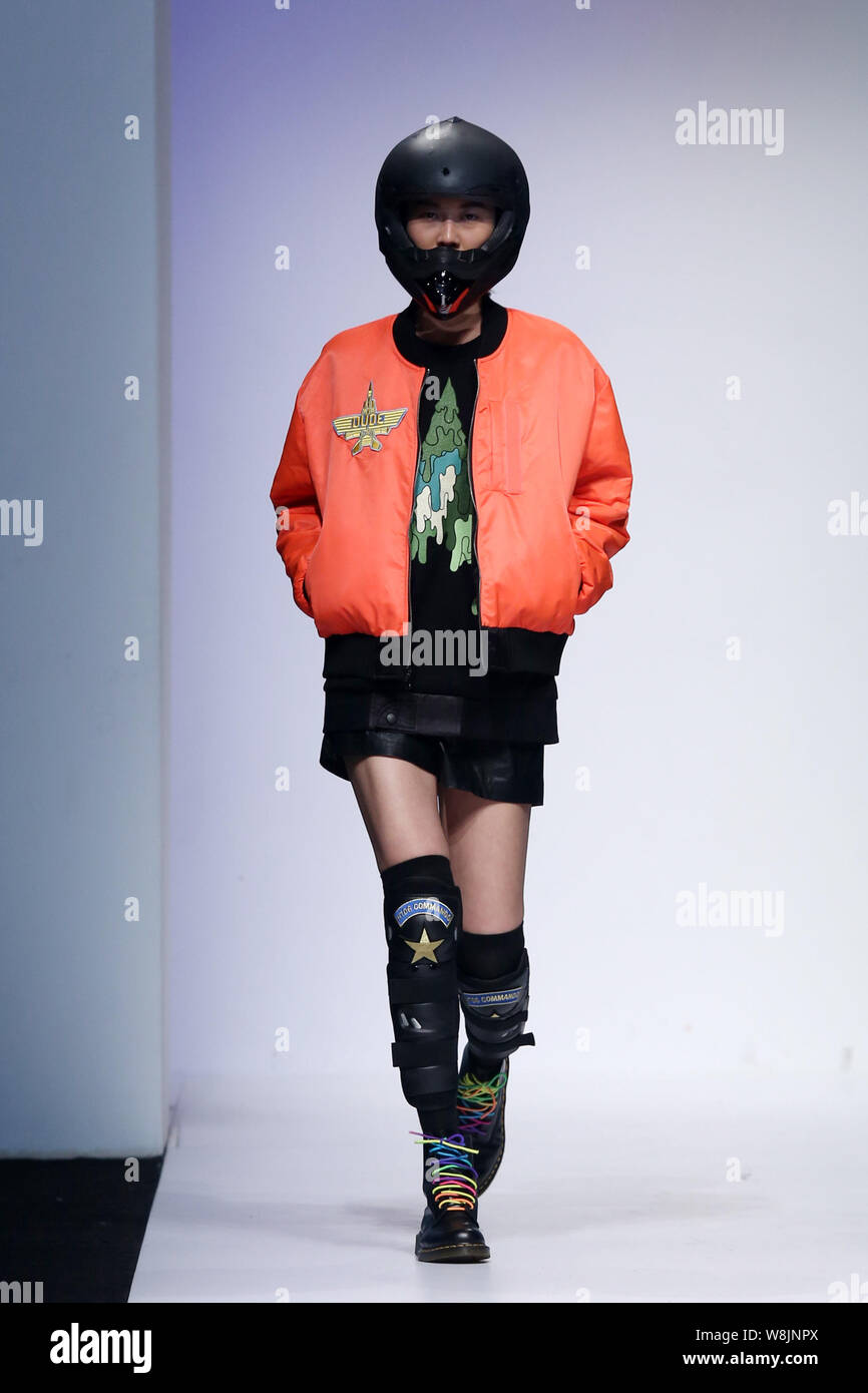 A model displays a new creation at Hong Kong singer and actor Leo Ku ...