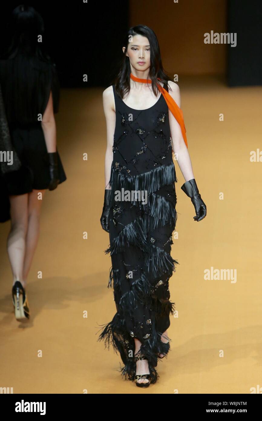 A model displays a new creation by Chinese fashion designer Wang Yutao at the Wang Yutao fashion ...