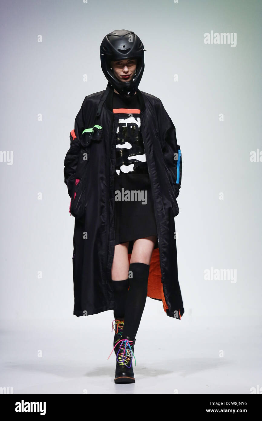 A model displays a new creation at Hong Kong singer and actor Leo Ku ...