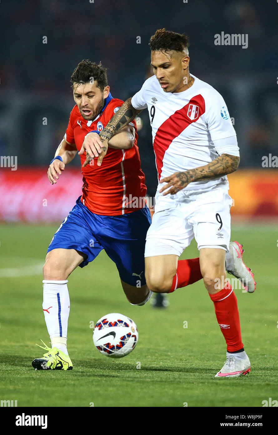 Chile's Jose Rojas, left, challenges Peru's Jose Guerrero during the ...