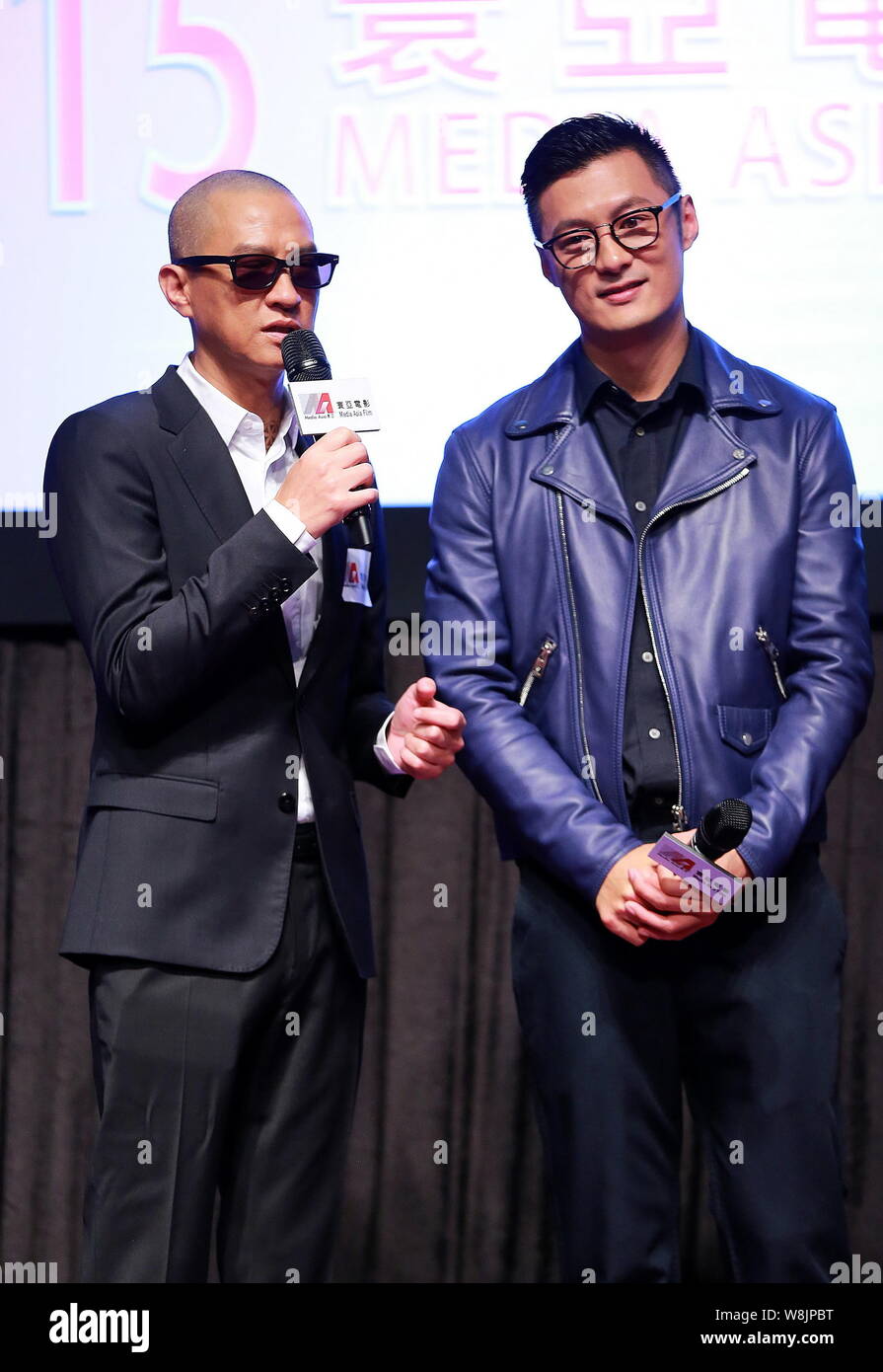 Hong Kong actor Nick Cheung, left, speaks as actor Shawn Yue listens ...