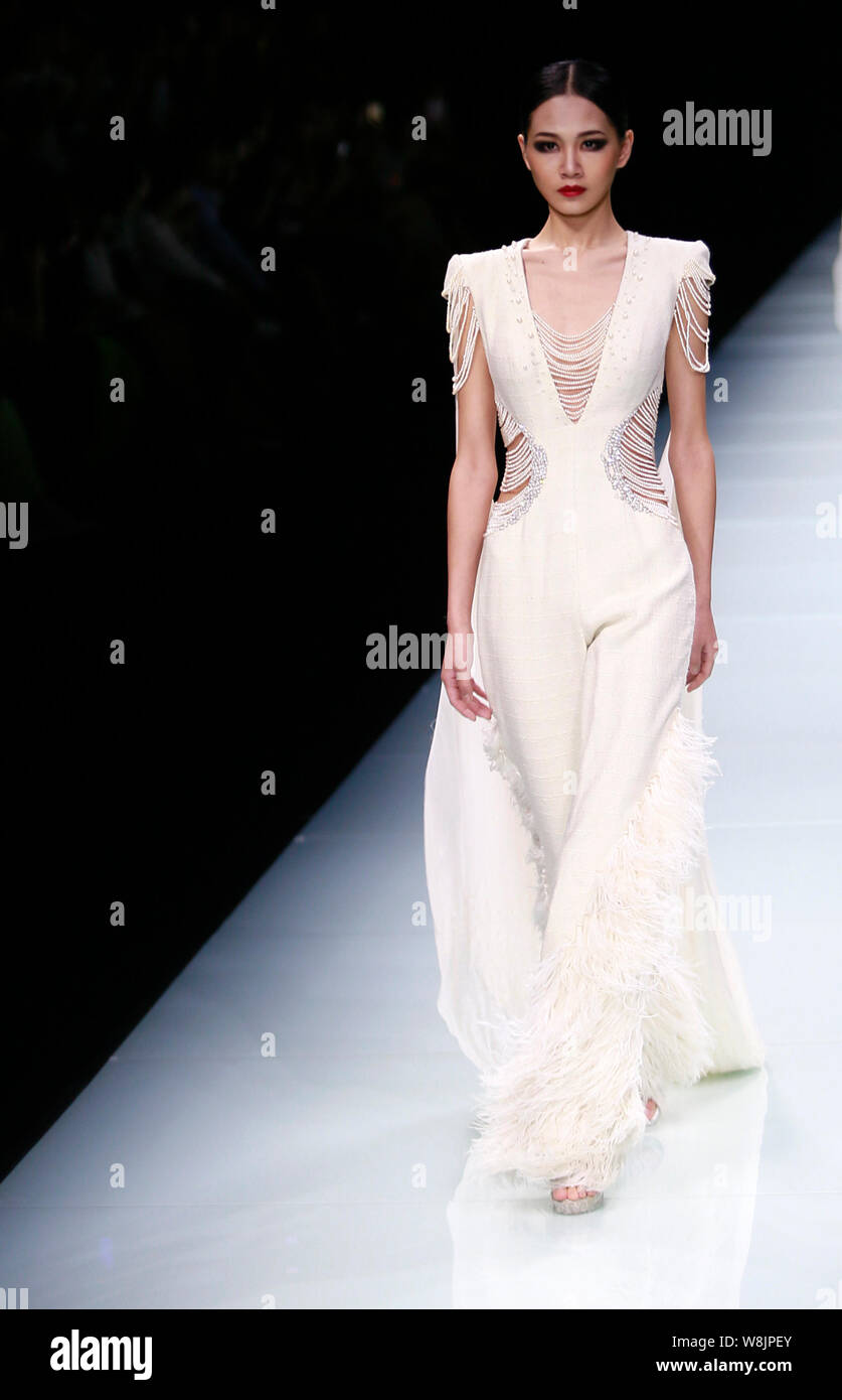 A model displays a new creation by Chinese fashion designer Mary Ma in ...