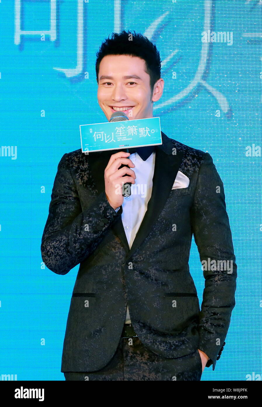Chinese actor Huang Xiaoming smiles during a press conference for his ...
