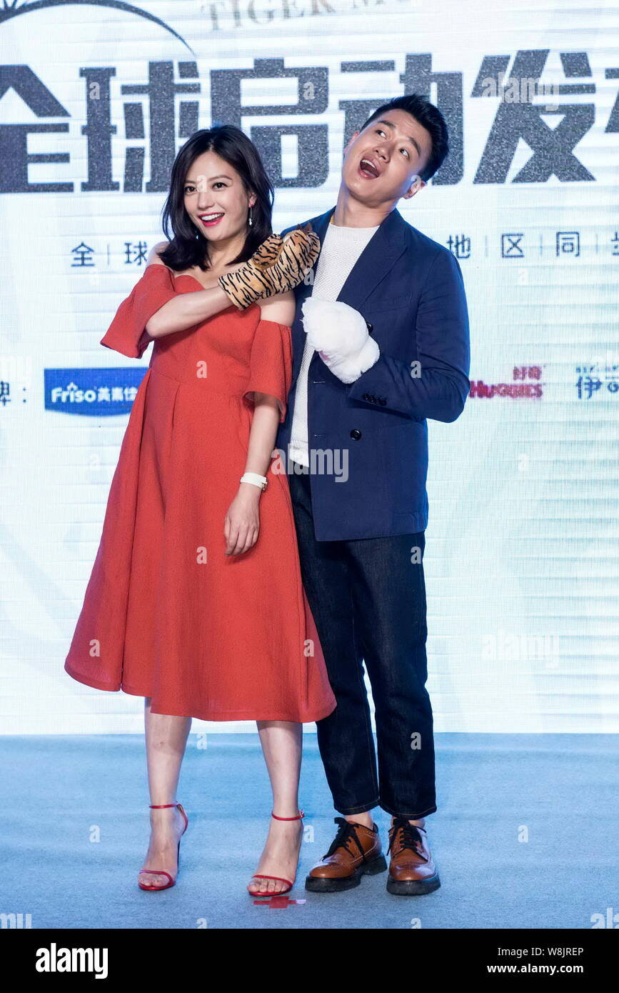 Chinese actress Zhao Wei, left, and actor Tong Dawei, right, pose ...