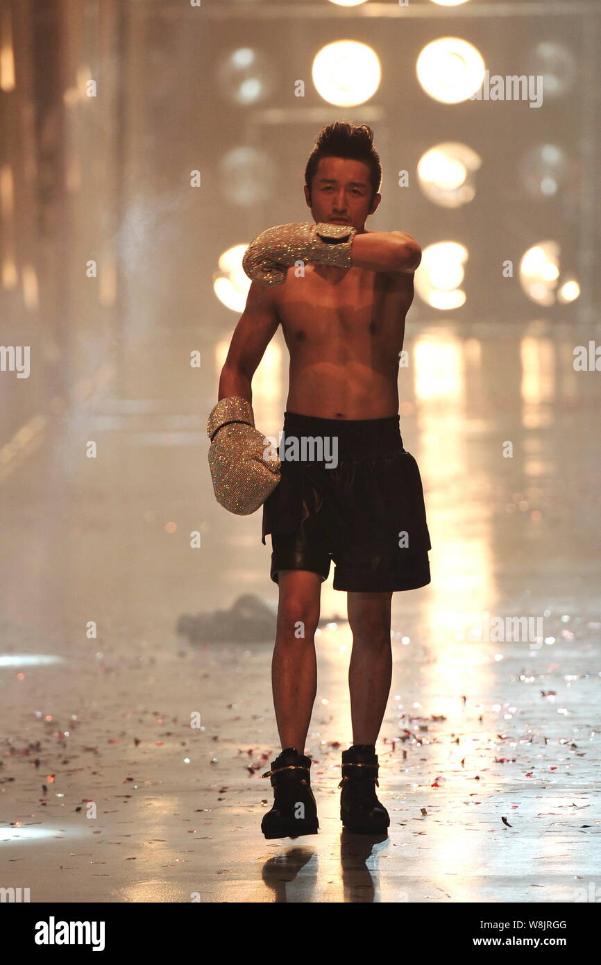Chinese boxing champion Zou Shiming displays a new creation in Chi ...