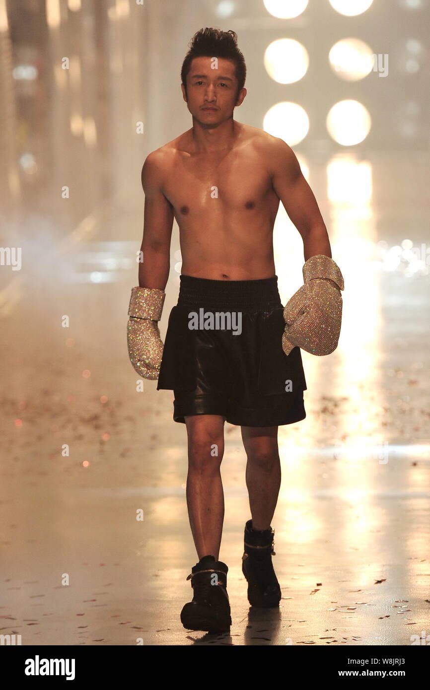 Chinese boxing champion Zou Shiming displays a new creation in Chi ...