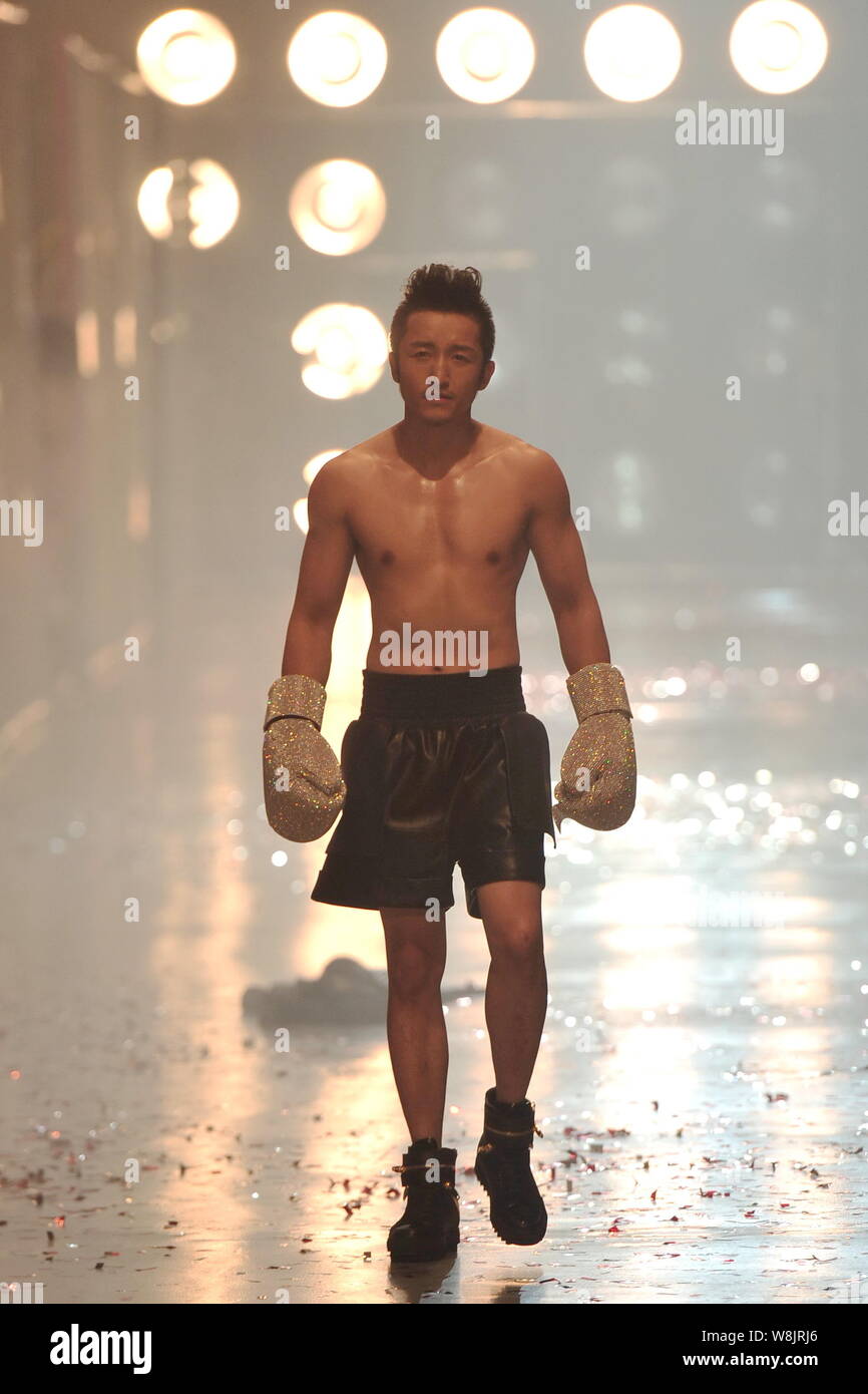 Chinese boxing champion Zou Shiming displays a new creation in Chi ...