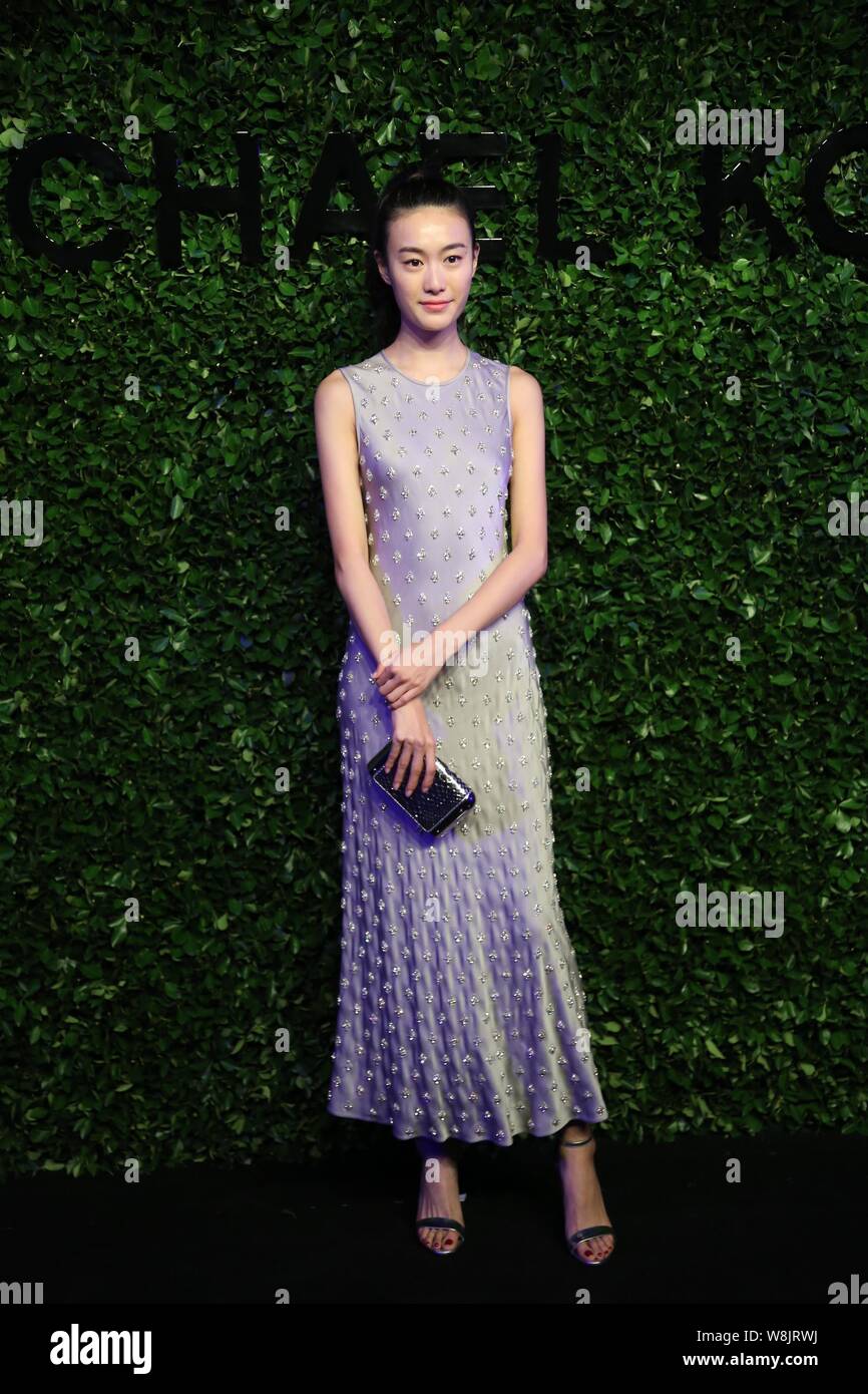 Chinese model Qin Shupei poses as she arrives for the Michael Kors ...