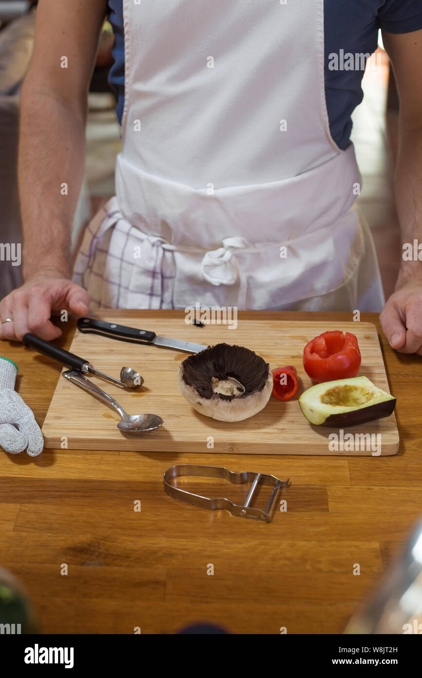 process of stuffing vegetables with meat rustic decor homemade concept ...