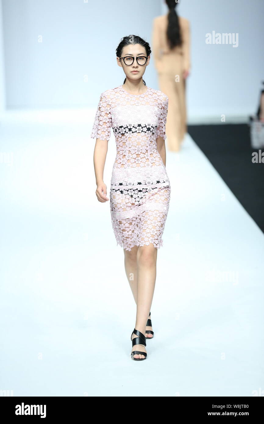 A model displays a new creation by designer Alicia Lee at the fashion ...