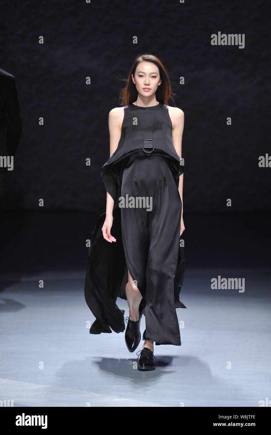 A model displays a new creation at the Harrison Wong fashion show of ...