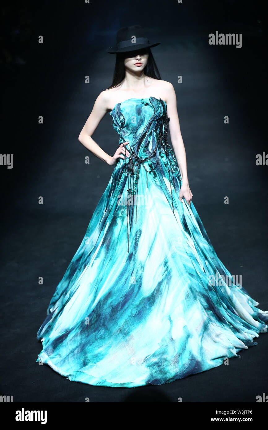 A model displays a new creation at the MERISIS fashion show by Chinese ...