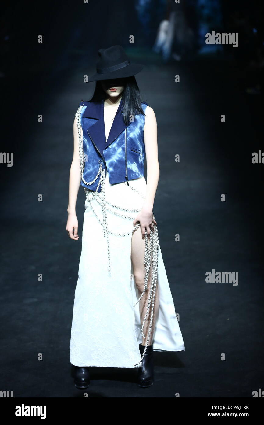 A model displays a new creation at the MERISIS fashion show by Chinese ...