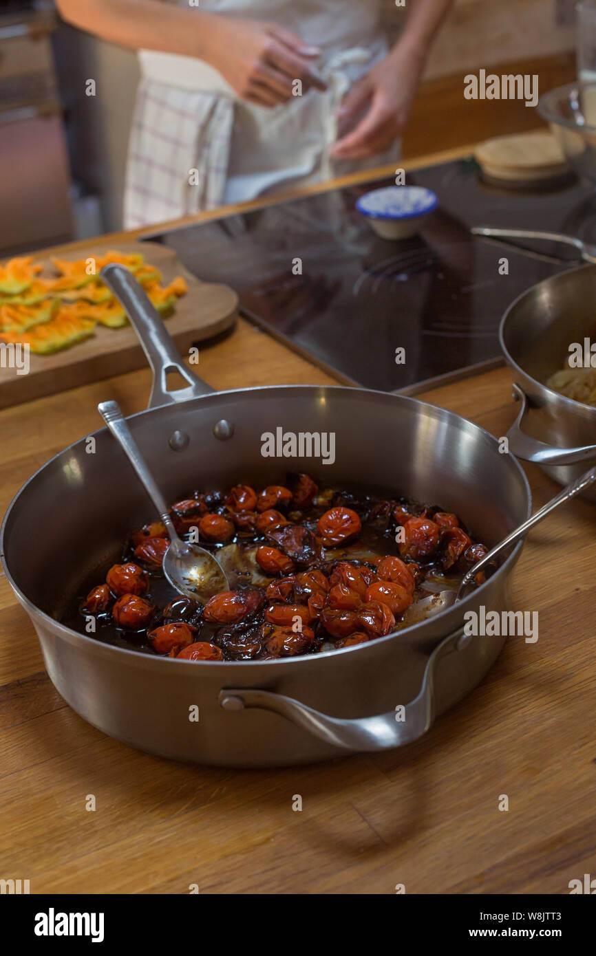 Adding tomatoes pot plate hi-res stock photography and images - Alamy