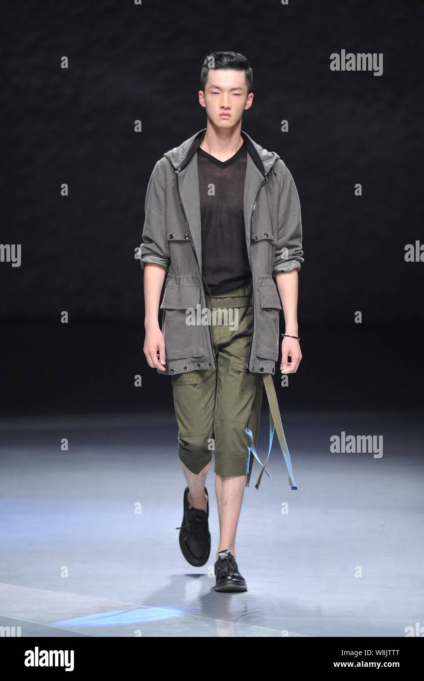 A model displays a new creation at the Harrison Wong fashion show of ...