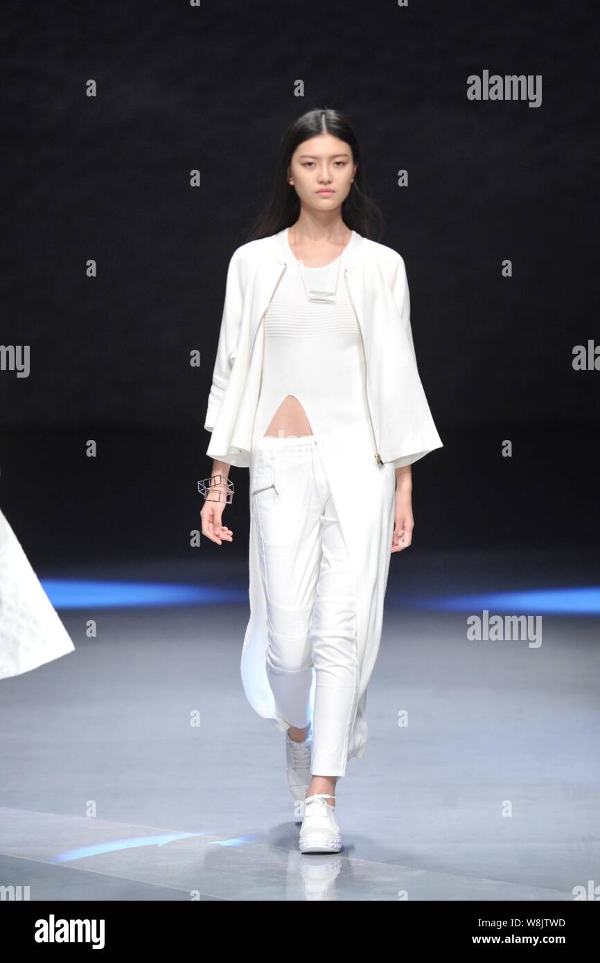 A model displays a new creation at the Harrison Wong fashion show of ...