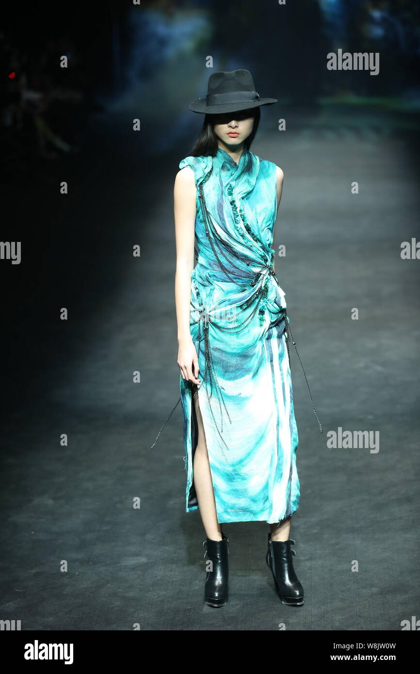 A model displays a new creation at the MERISIS fashion show by Chinese ...