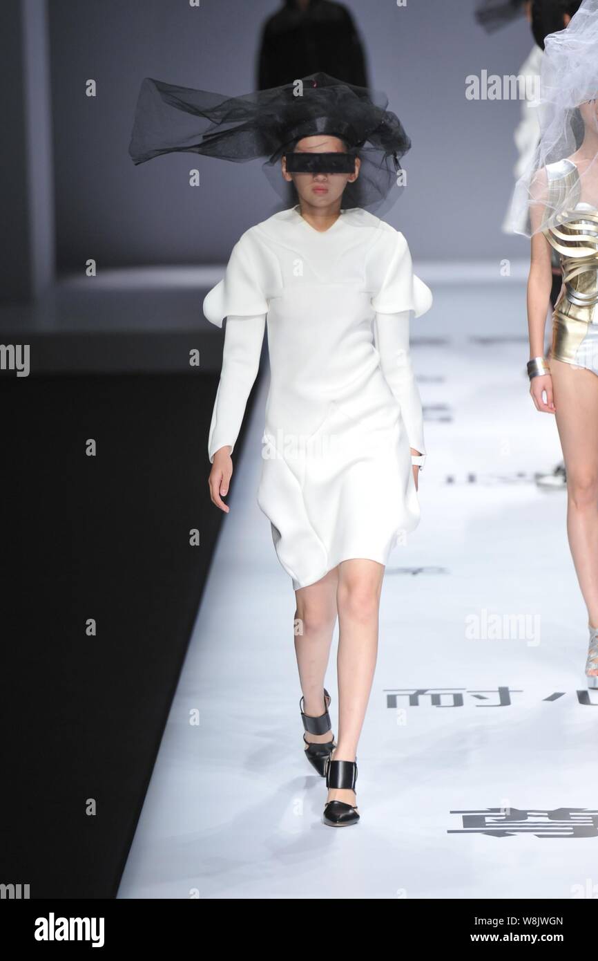 A model displays a new creation at the fashion show of IM International ...