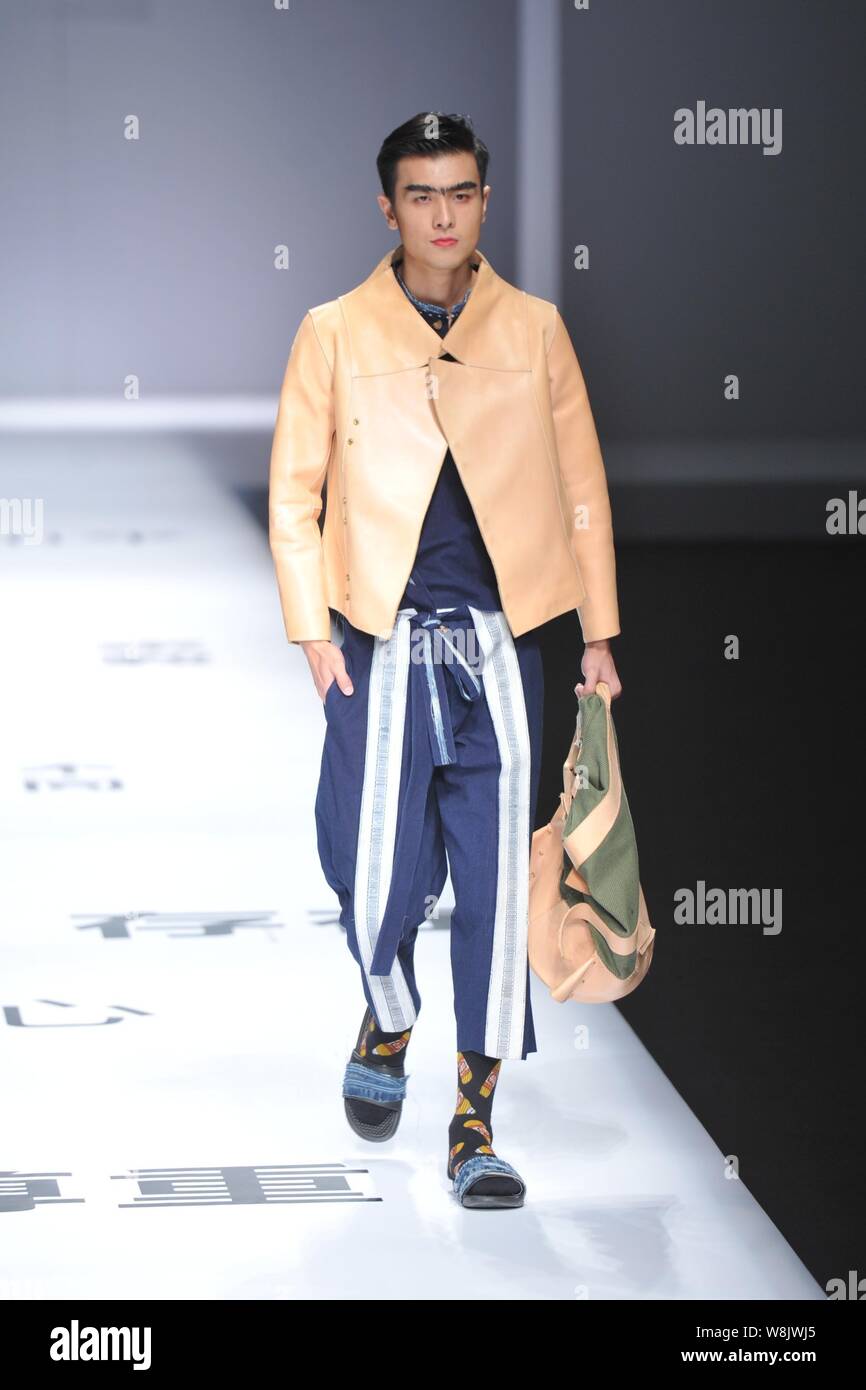 A model displays a new creation at the fashion show of IM International ...
