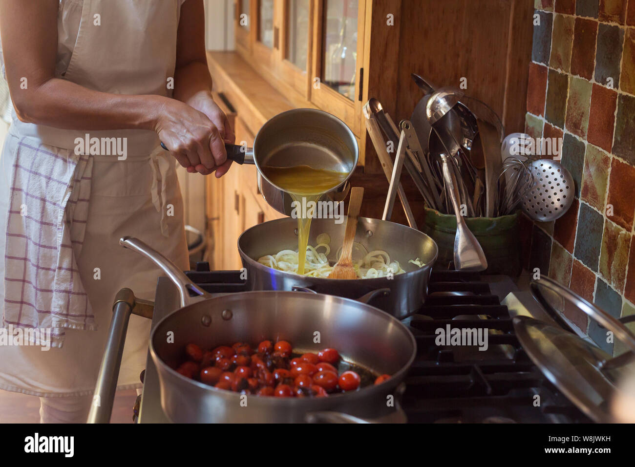 Adding tomatoes pot plate hi-res stock photography and images - Alamy
