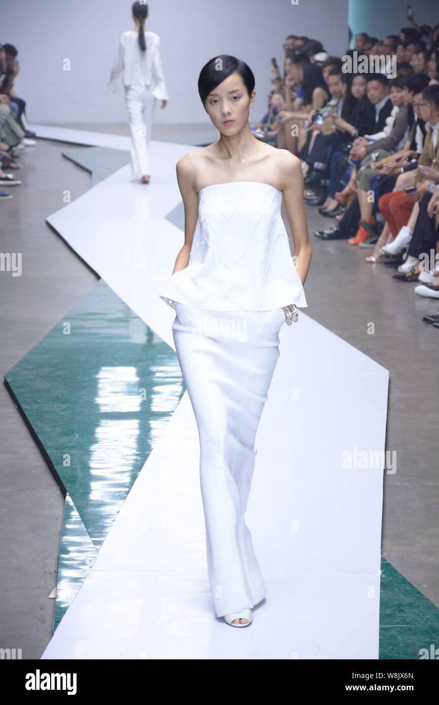 Chinese model Pei Bei displays a new creation at the fashion show for ...